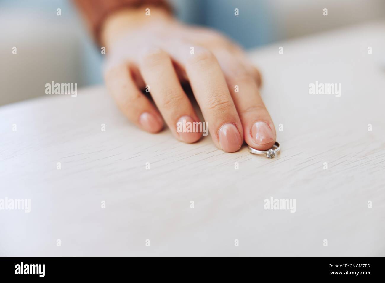 Womans Hand With Ring Close Up On Table Divorce And Loss Of Partner