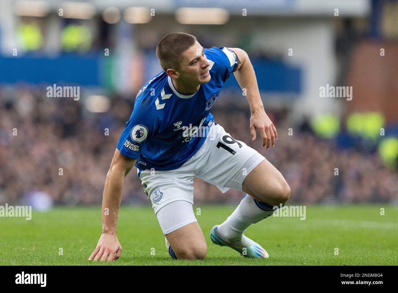 Vitaliy Mykolenko #19 of Everton goes down injured during the Premier ...