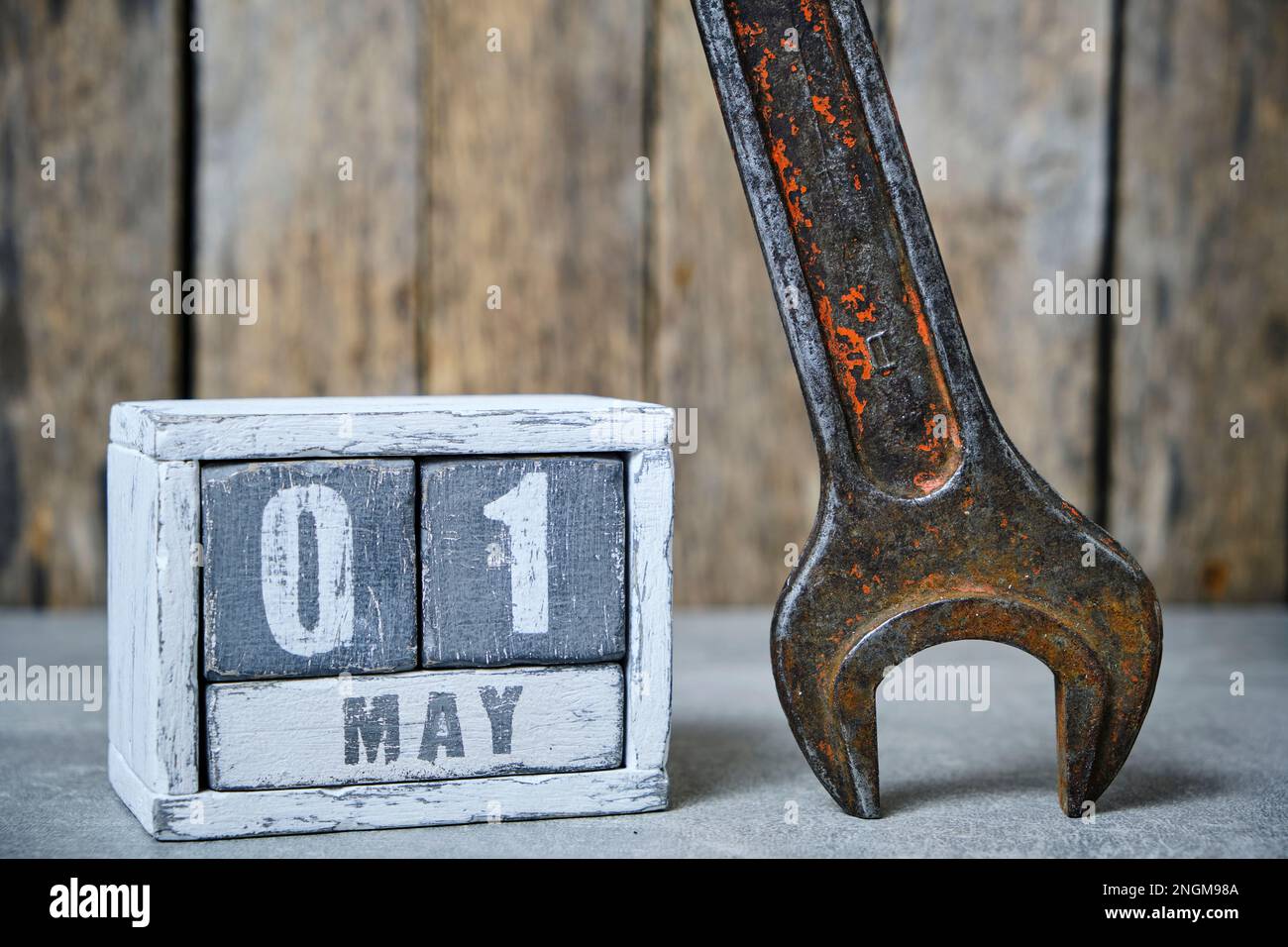 First May on calendar made wood and wrench on background.Concept Labor ...