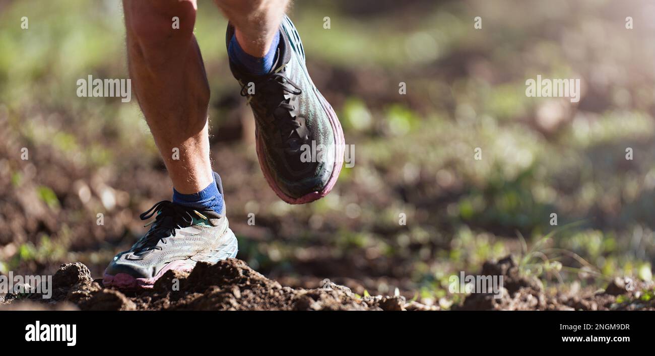 Trail running athlete exercising for fitness and health outdoors on ...