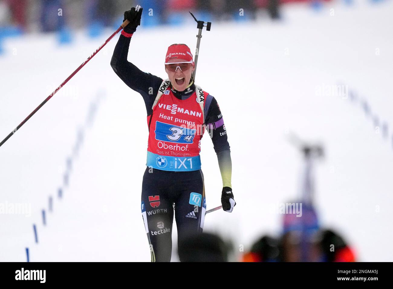 Denise Herrmann-Wick, of Germany, celebrates as she crosses the finish ...