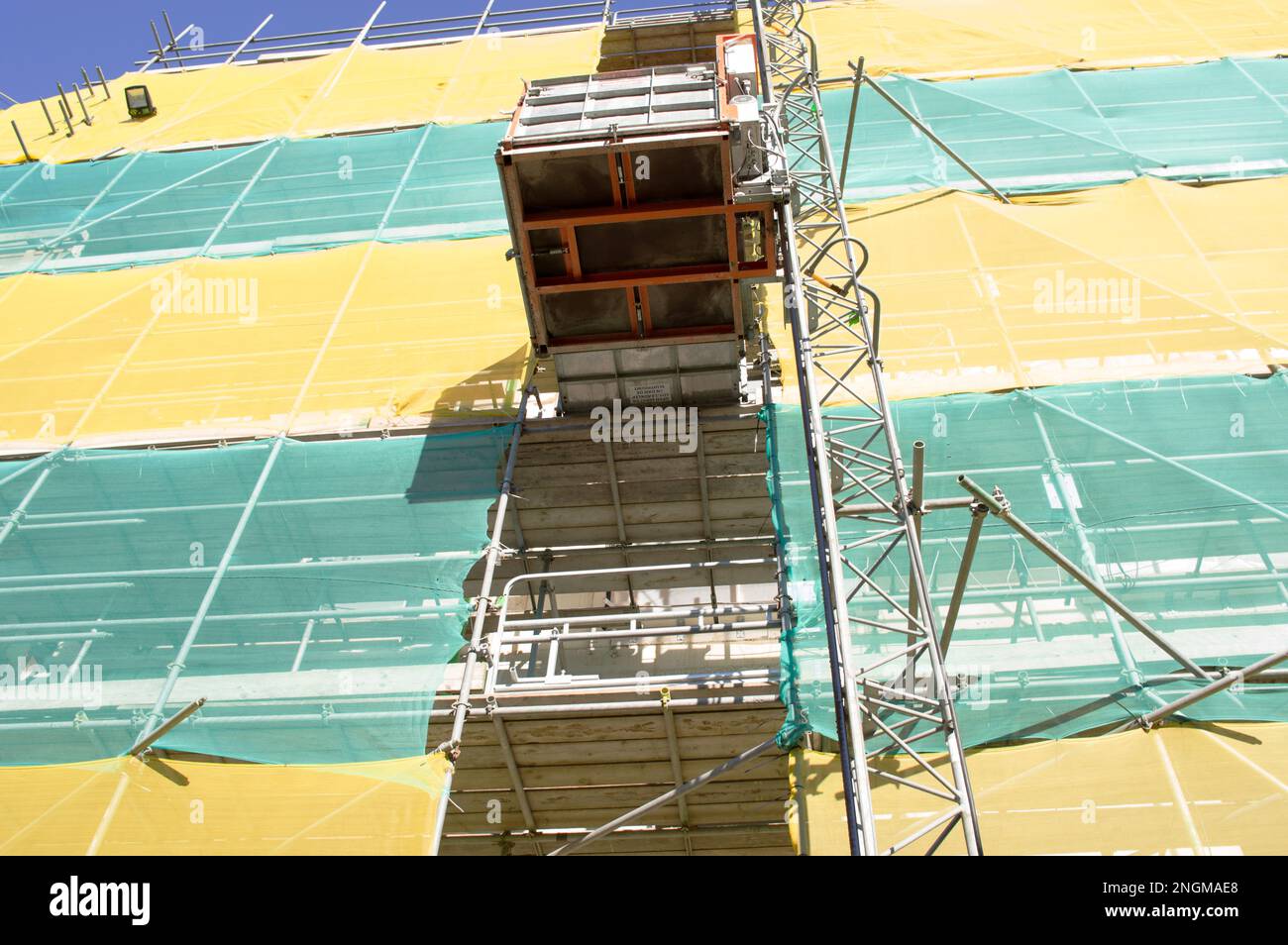 Bottom view of construction elevator of a building under construction ...