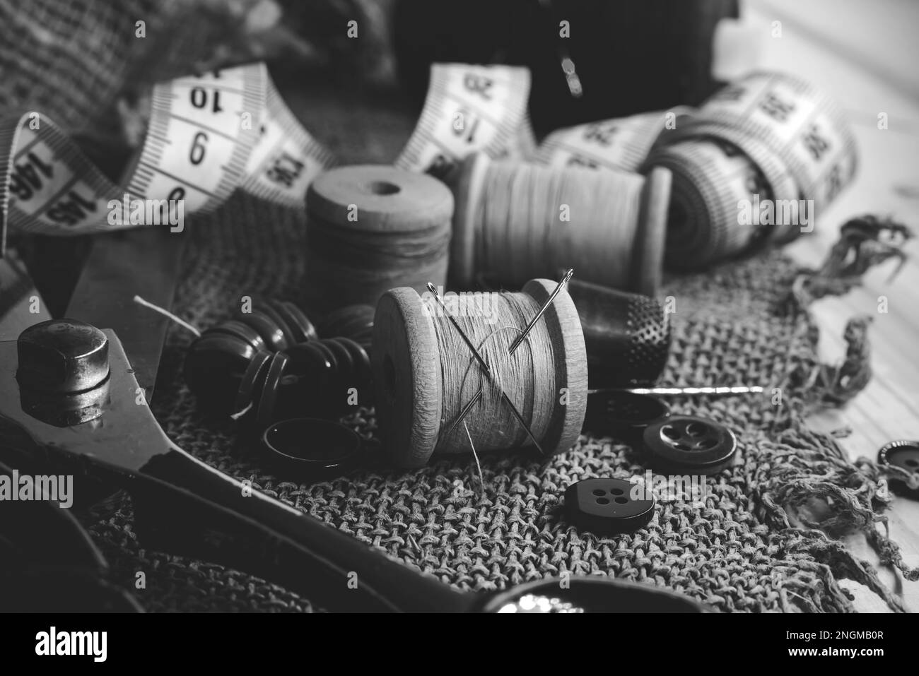 Retro tools for cutting and sewing. Needle with thread, thimble, sewing ...