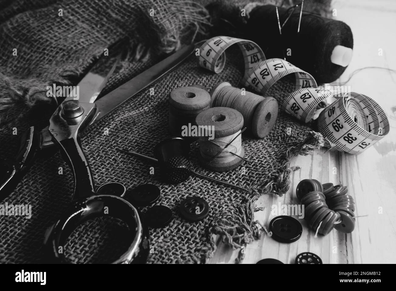 Retro tools for cutting and sewing. Needle with thread, thimble, sewing ...