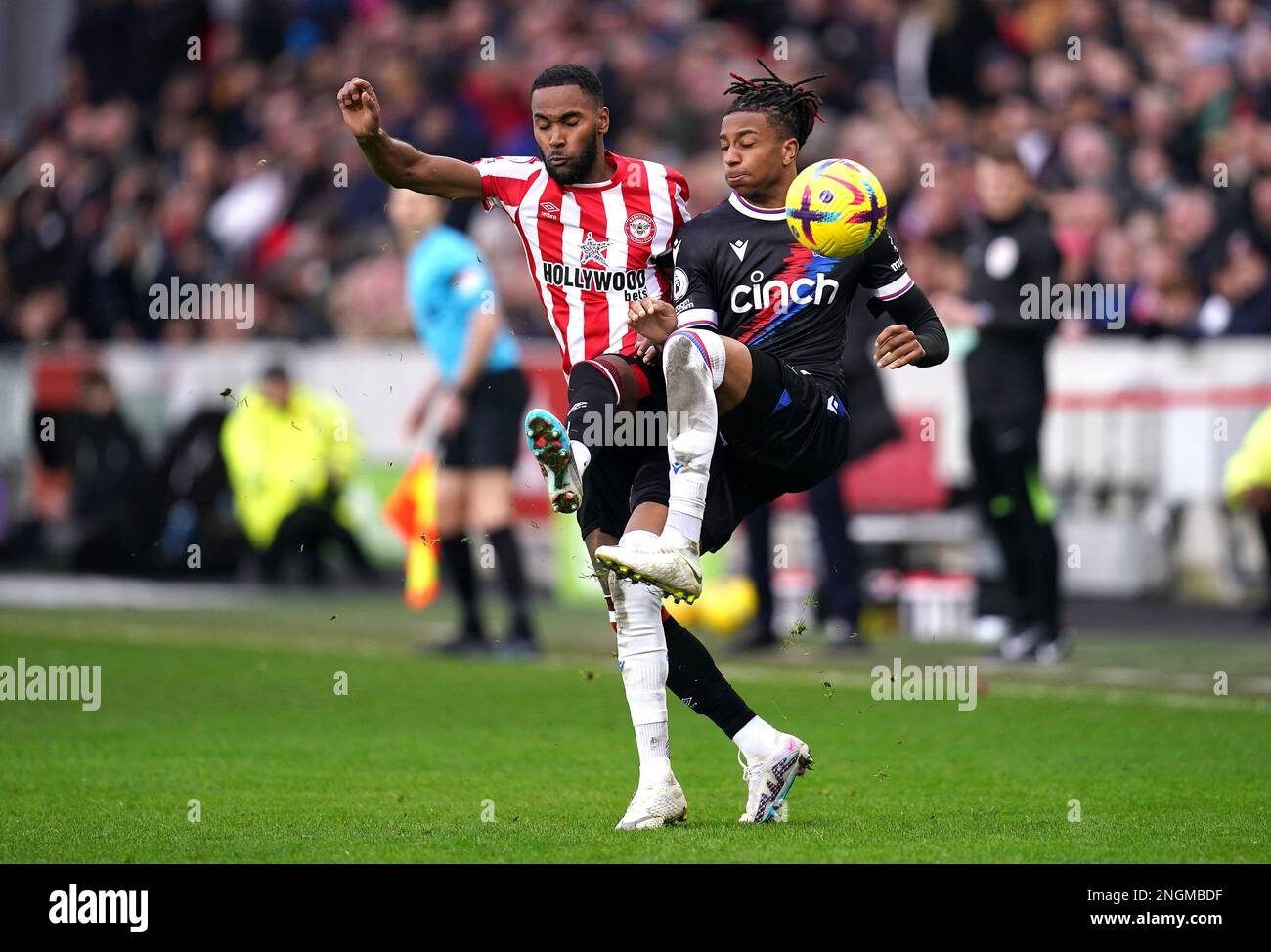 Brentford's Rico Henry (left) and Crystal Palace's Michael Olise battle ...