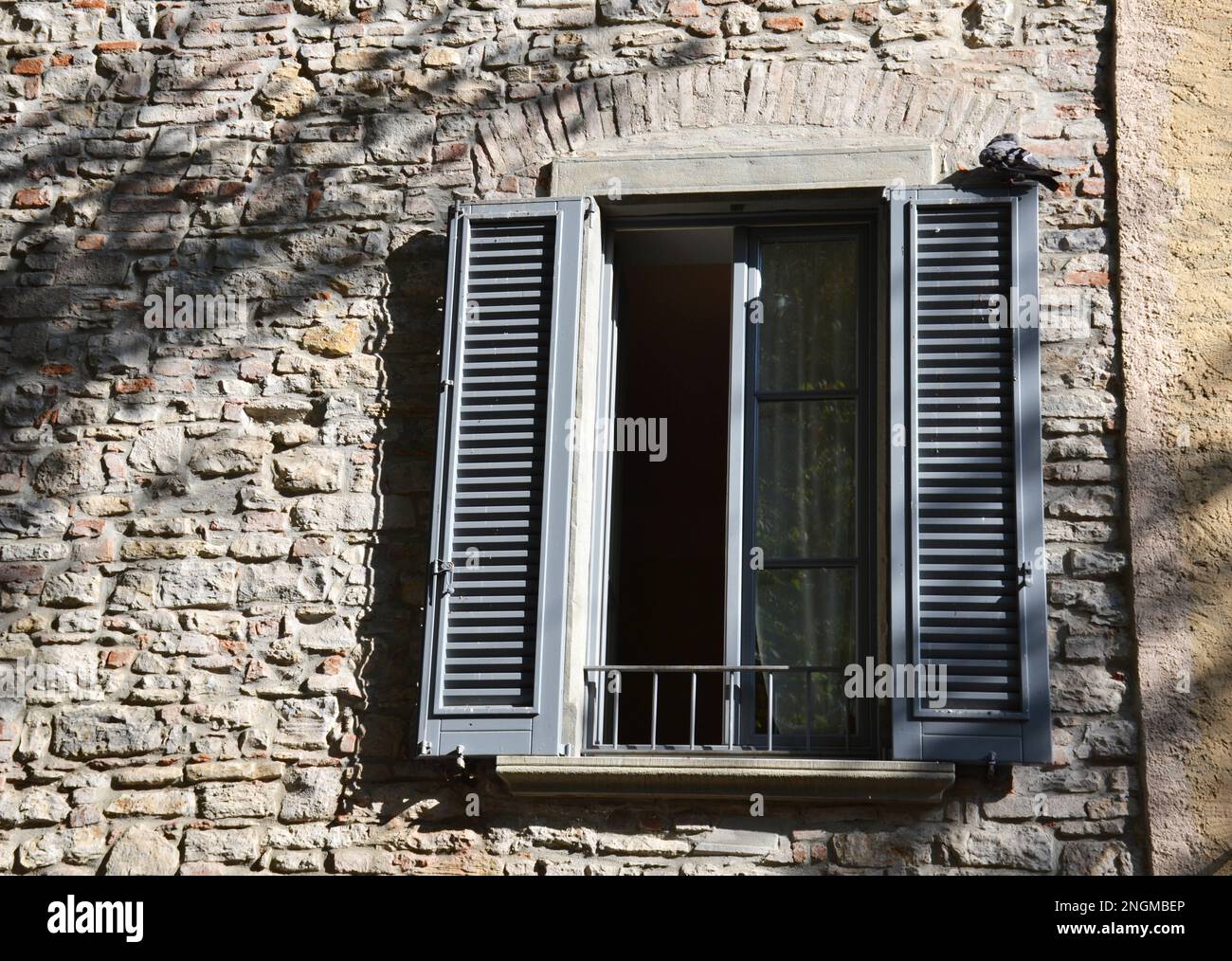 Italian window in an old stone house Stock Photo - Alamy