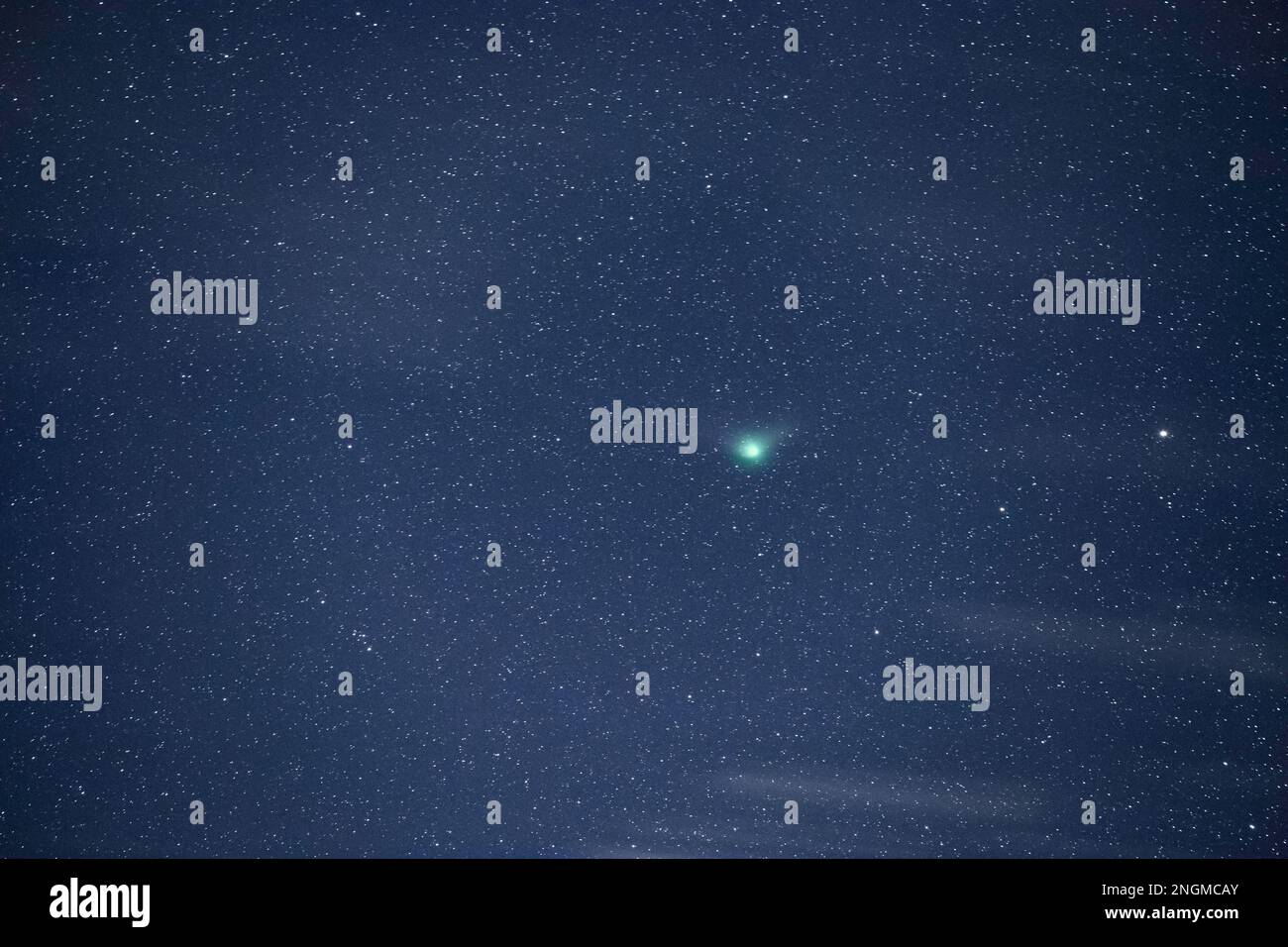 A beautiful star filled night sky above a tranquil ocean, illuminated ...