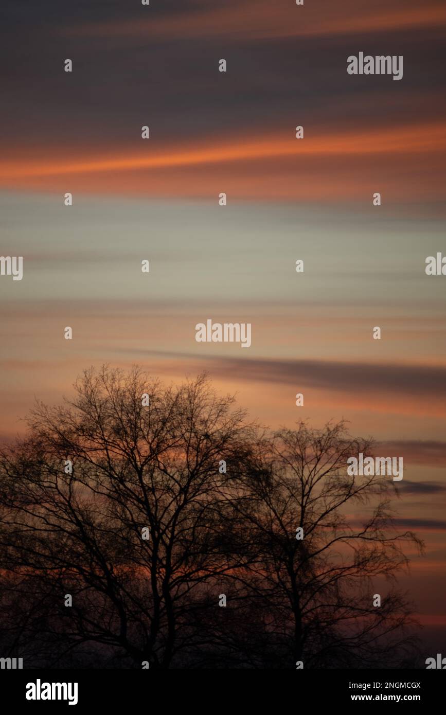 Muted orange and teal pastel sky with copy space Stock Photo - Alamy