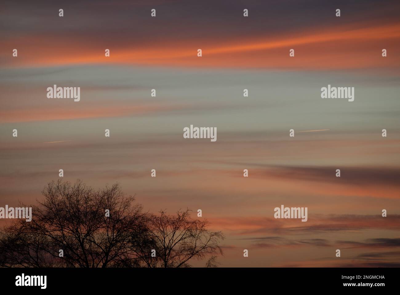 Muted orange and teal pastel sky with copy space Stock Photo - Alamy