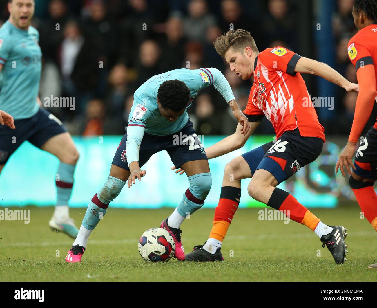 Burnley's Nathan Tella (left) and Luton Town's Reece Burke battle for ...