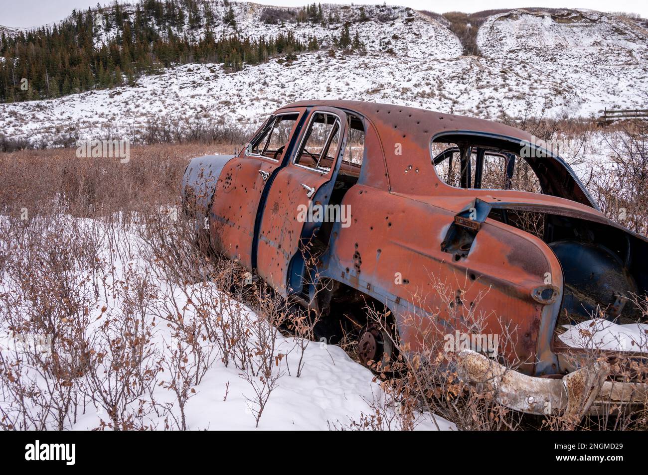 Abandoned vehicles in a cold badlands environment Stock Photo - Alamy