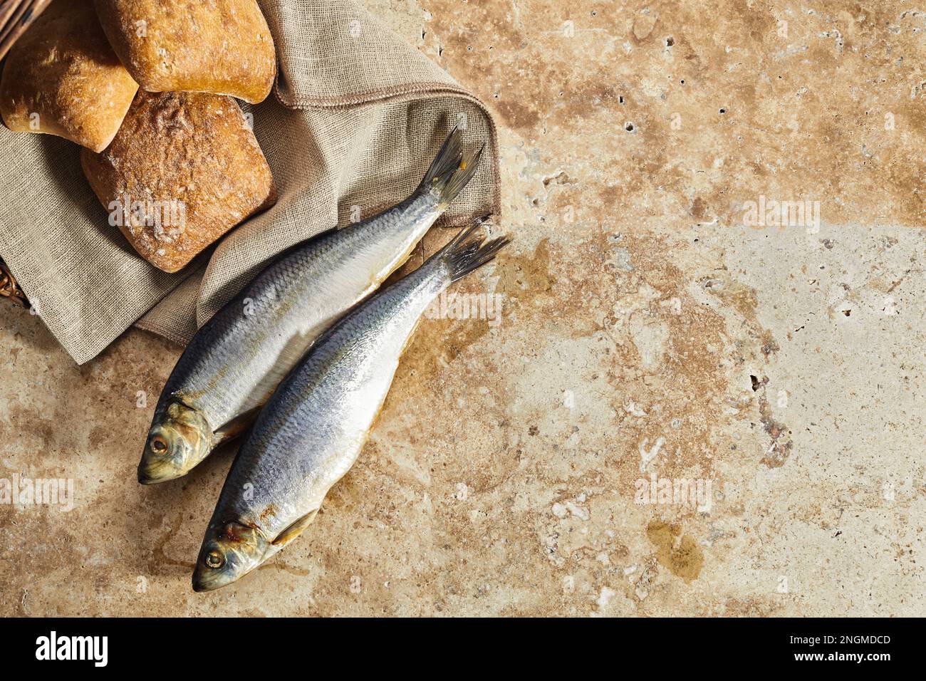 Christianity background. Loaves of bread and two fish in a basket Stock ...