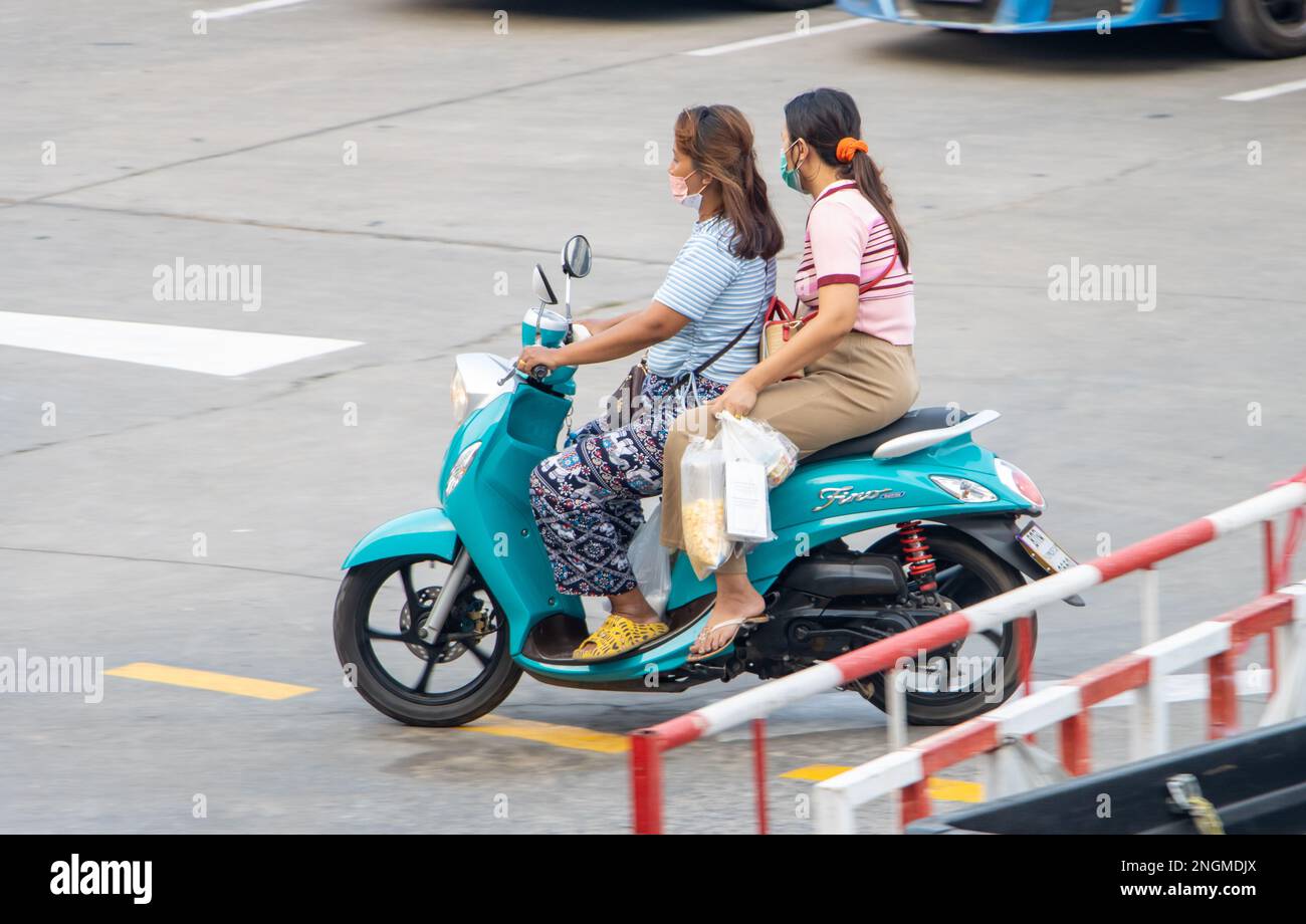 Two women on motorbike hi-res stock photography and images - Alamy