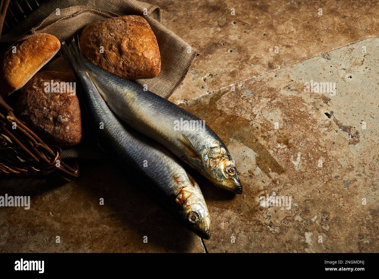 Christianity background. Loaves of bread and two fish in a basket Stock ...