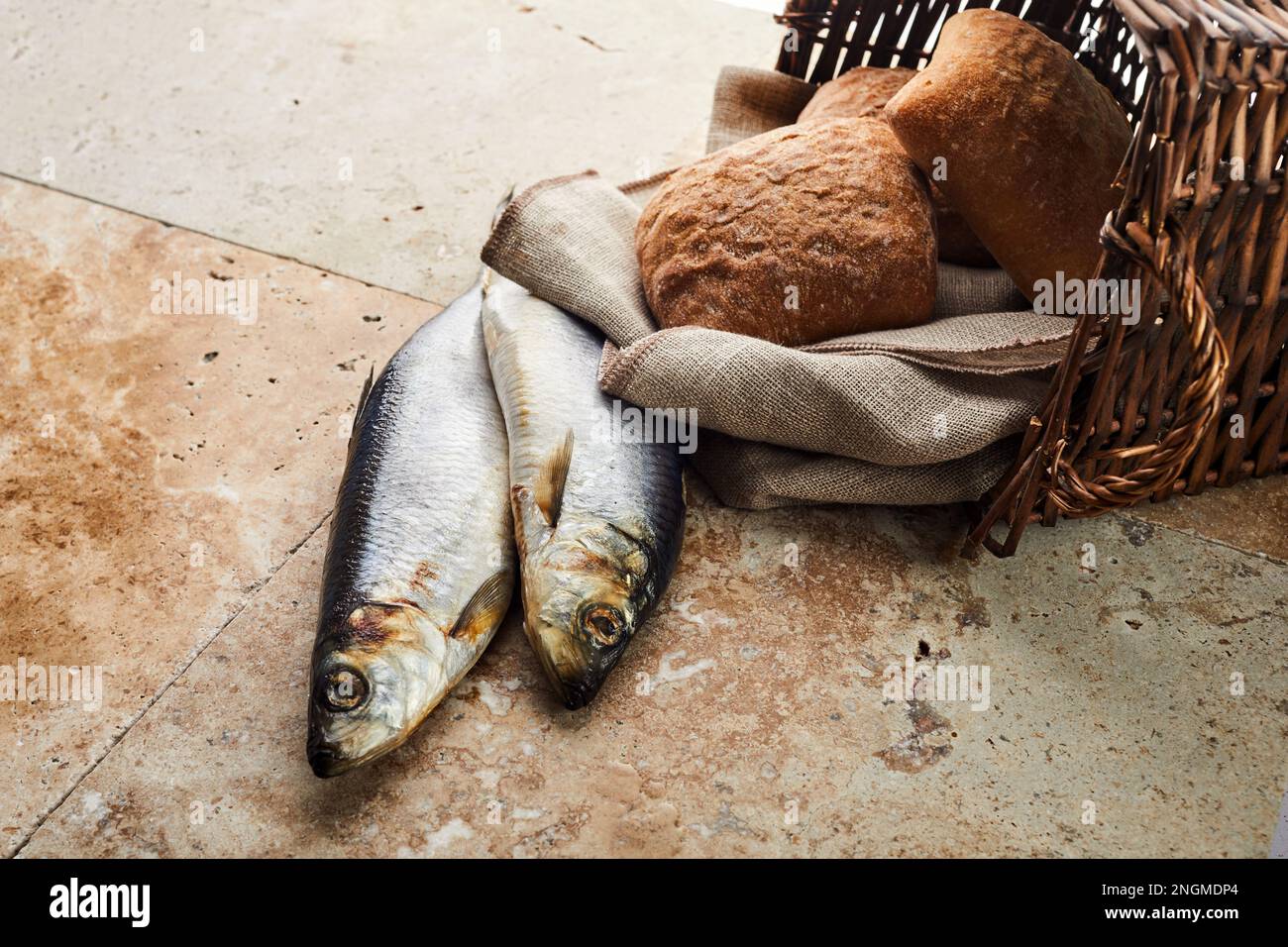 Christianity background. Loaves of bread and two fish in a basket Stock ...