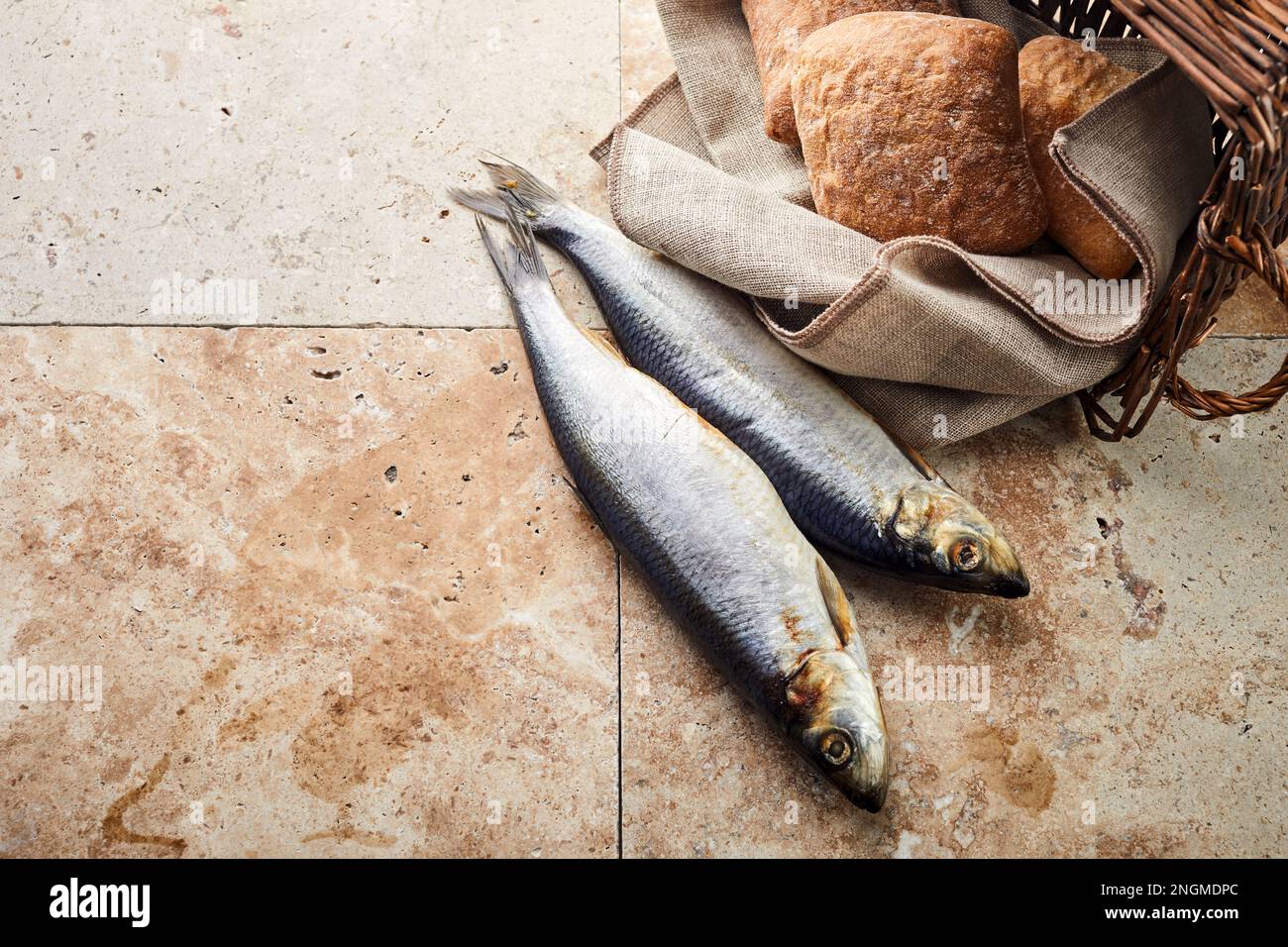 Christianity background. Loaves of bread and two fish in a basket Stock ...