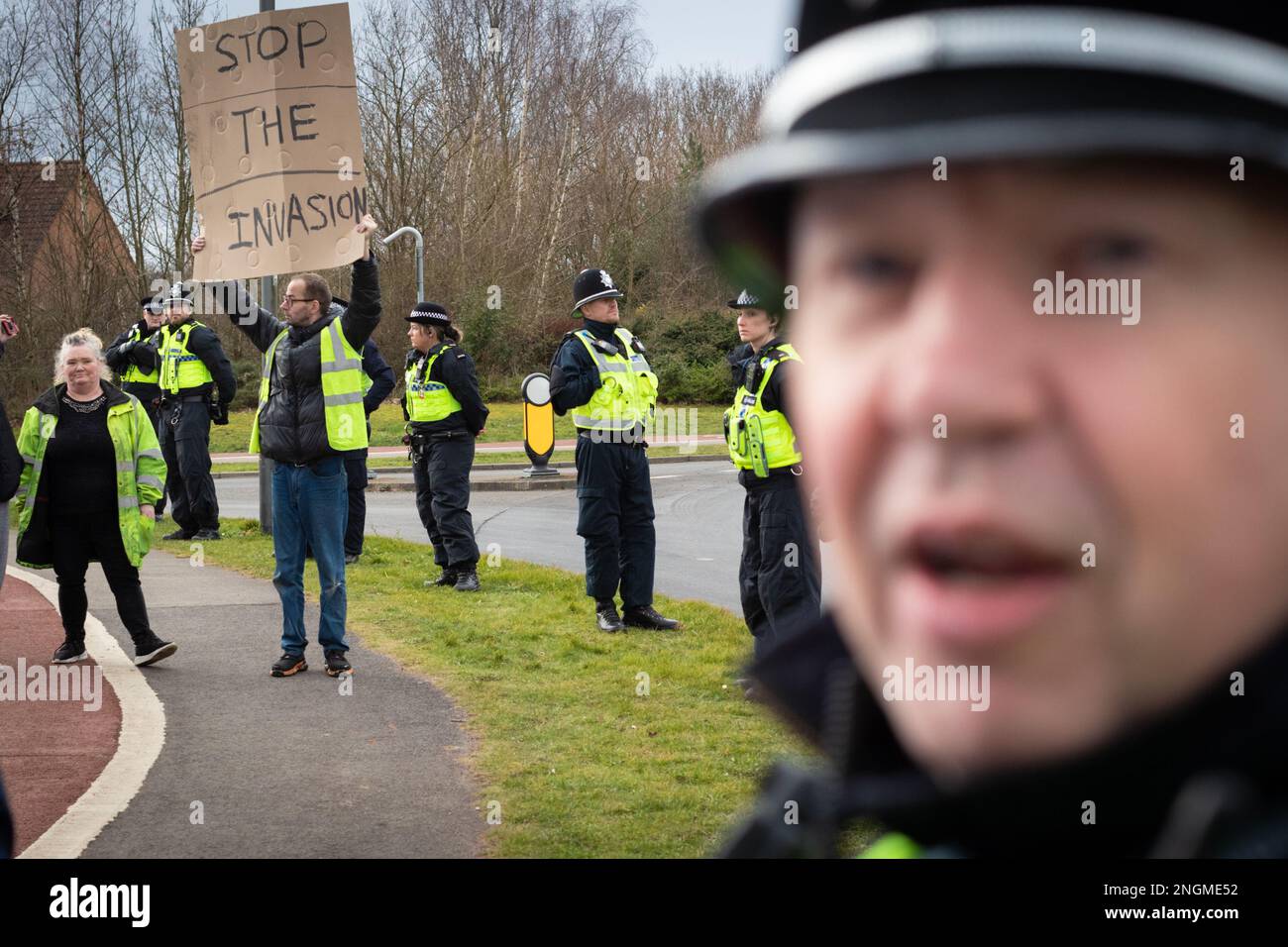 Rotherham, UK. 18th Feb, 2023. A anti-immigration demonstrator holds a ...