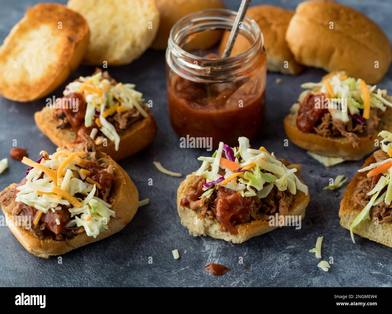 Toasted pulled pork sliders topped with homemade barbecue sauce Stock ...
