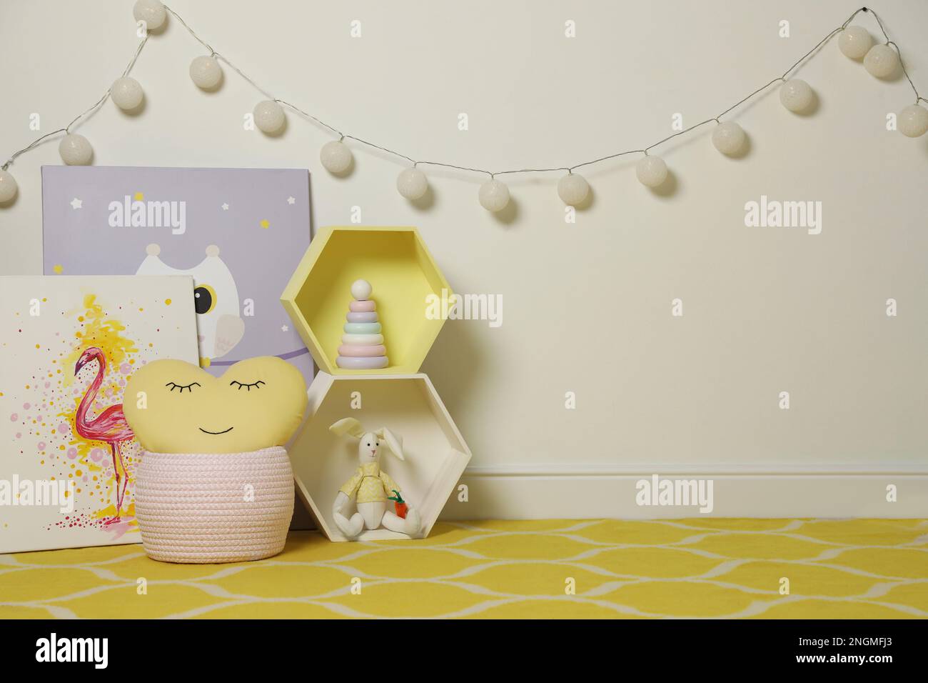 Posters and toys near light wall in baby room. Interior design Stock ...