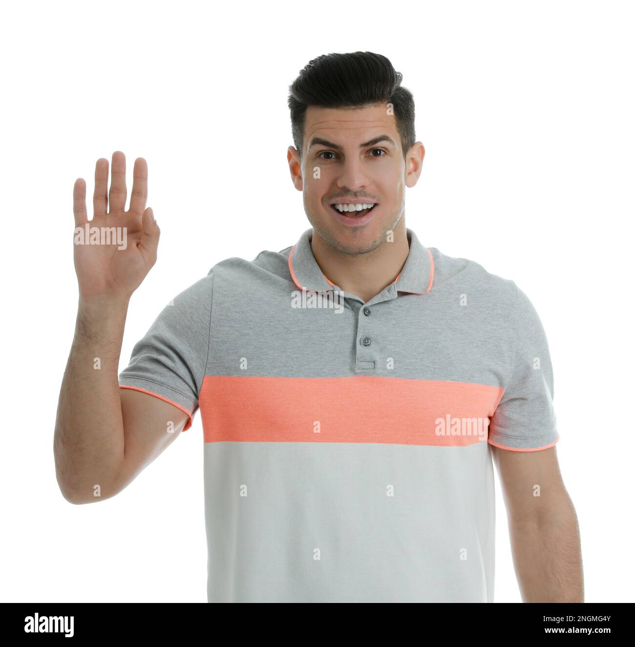 Cheerful man waving to say hello on white background Stock Photo - Alamy