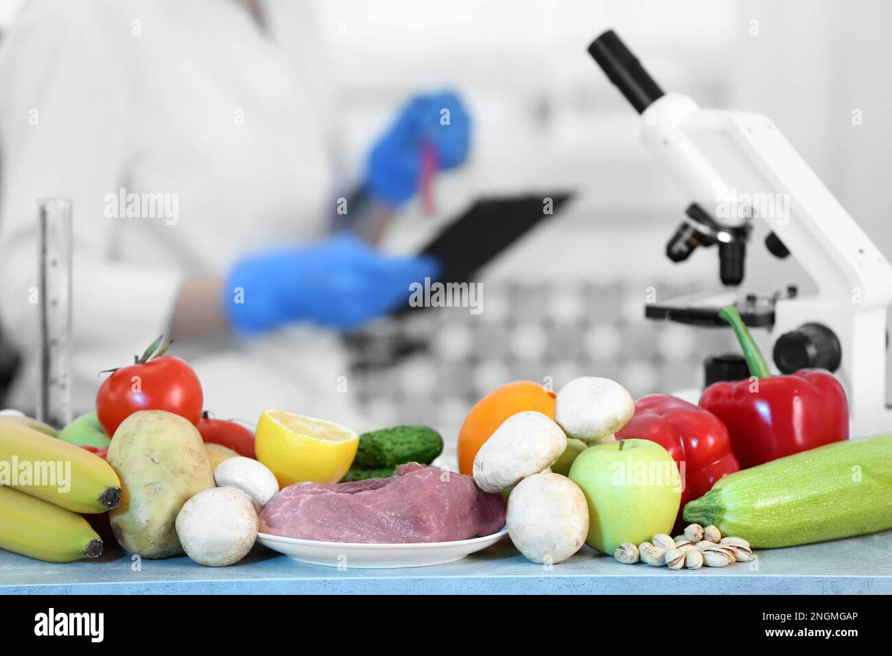 Fresh vegetables, fruits and meat on table in laboratory. Food quality ...