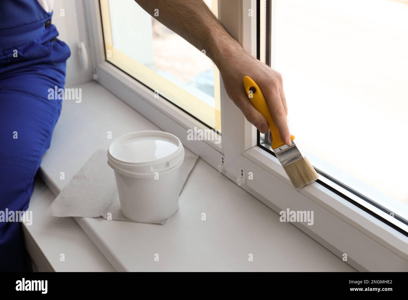 Man painting window frame at home, closeup Stock Photo - Alamy