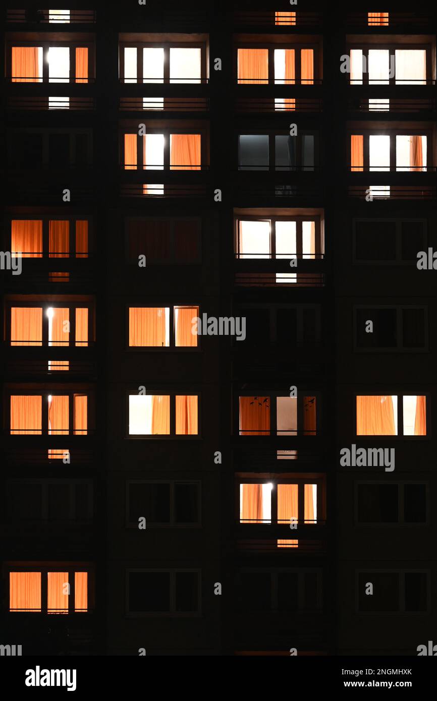 Illuminated Apartment Windows at Night in Urban Building in vertical ...