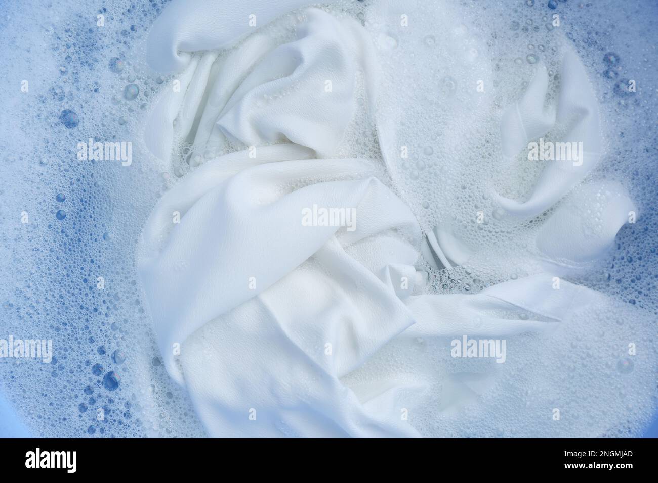 White clothing in suds, top view. Hand washing laundry Stock Photo - Alamy