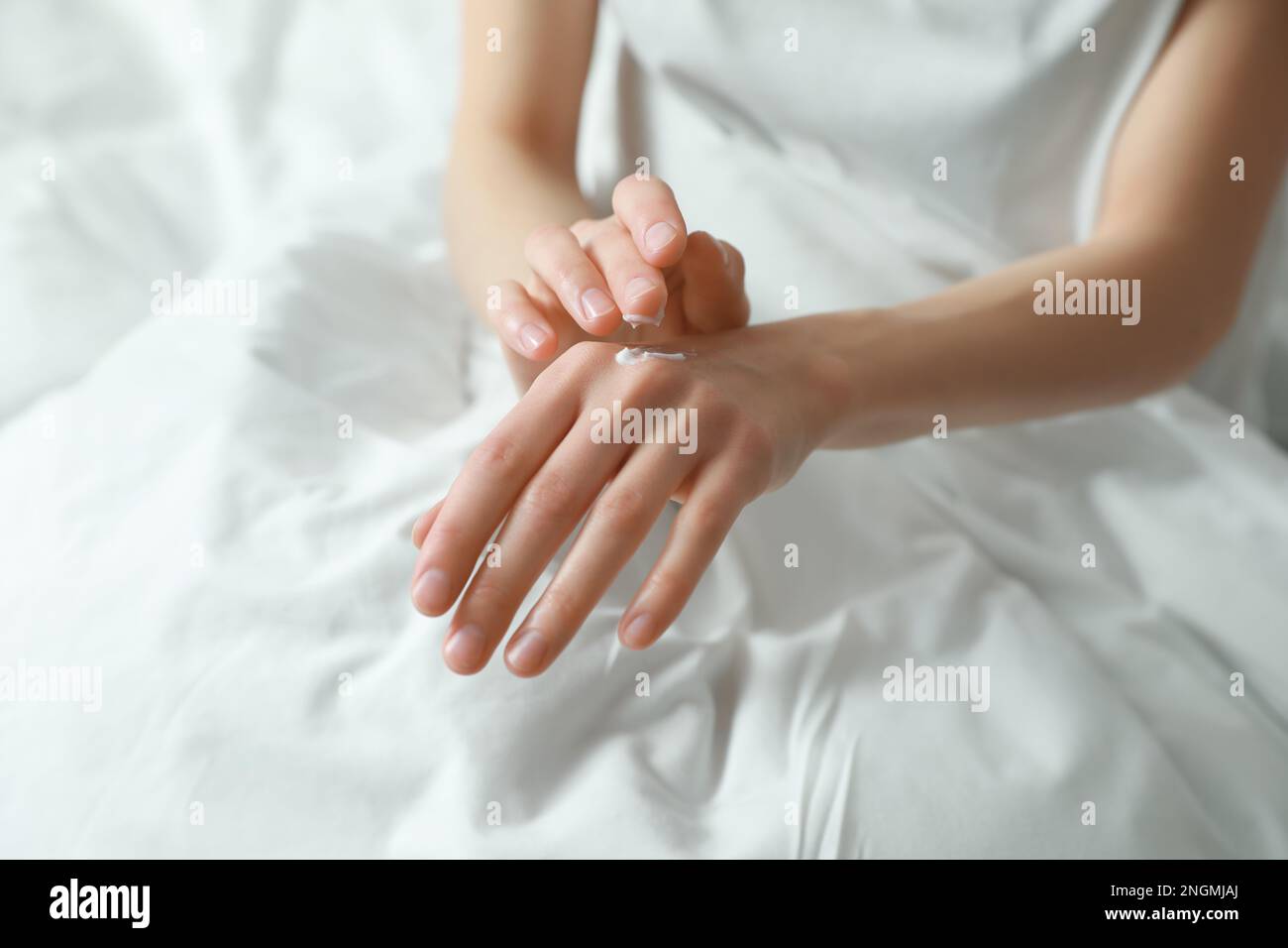Woman using moisturizing cream hands hi-res stock photography and ...