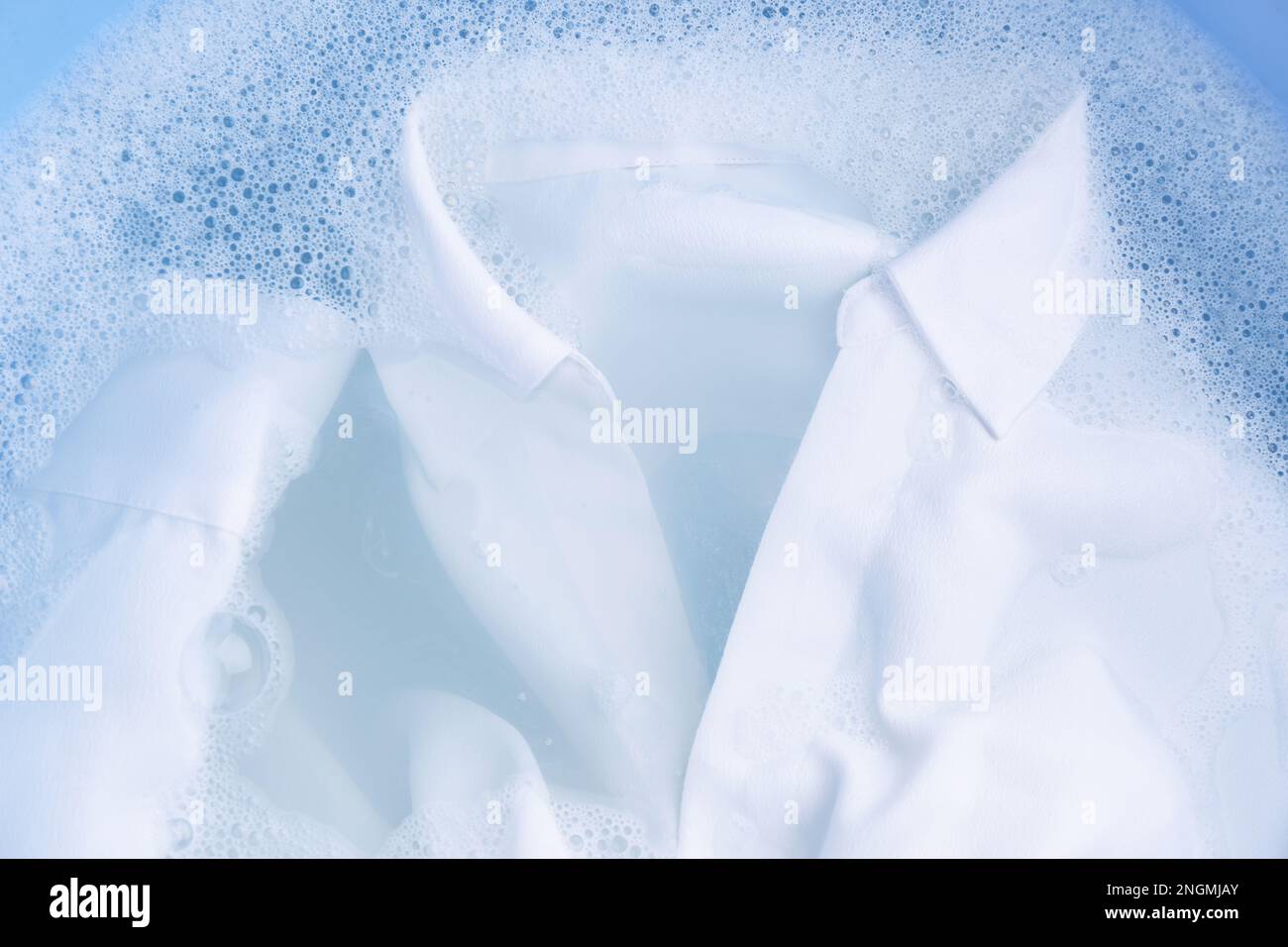 White clothing in suds, top view. Hand washing laundry Stock Photo - Alamy