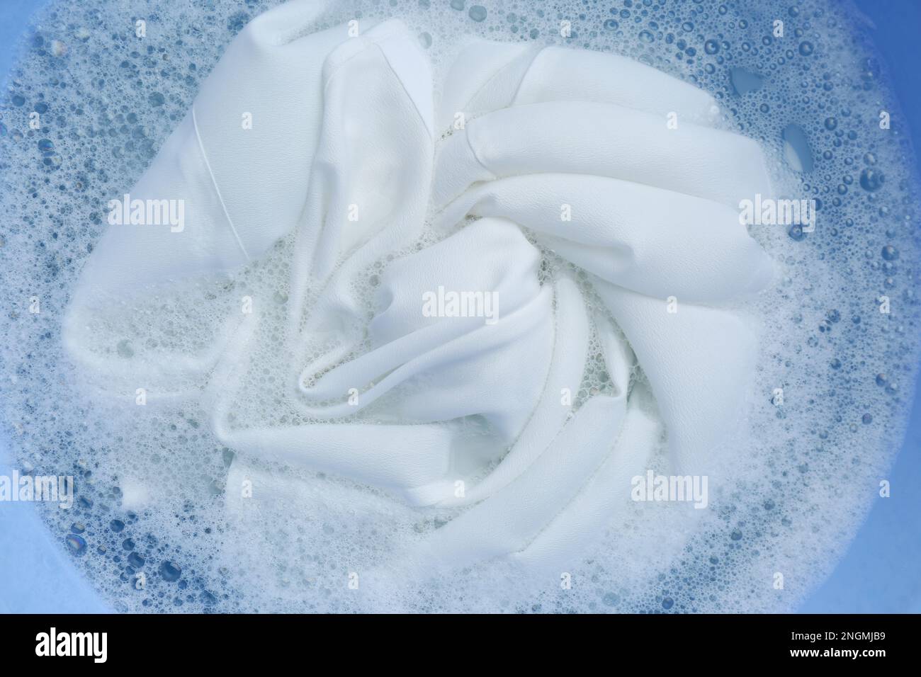 White clothing in suds, top view. Hand washing laundry Stock Photo - Alamy