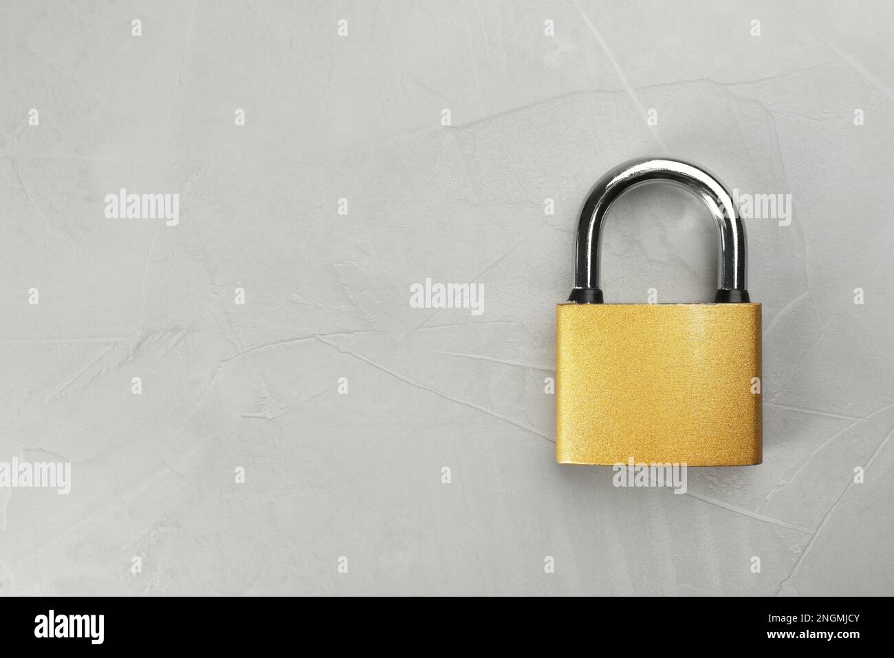 Modern padlock on light grey table, top view. Space for text Stock ...