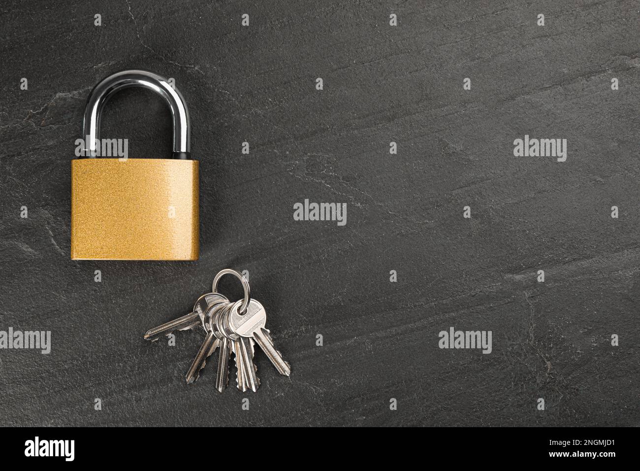 Modern padlock with keys on black table, flat lay. Space for text Stock ...