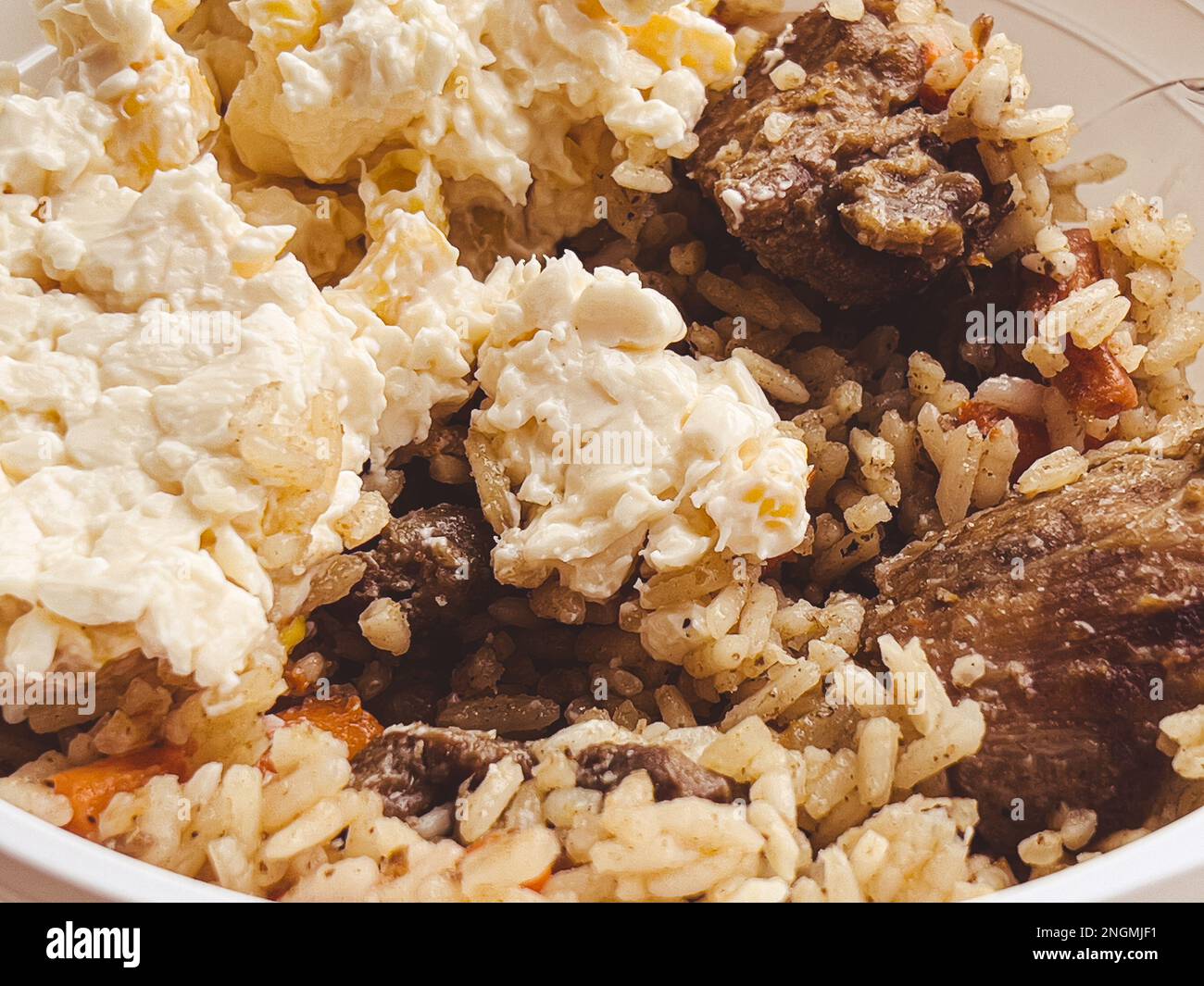 Street Food with rice and meat - Close-up shot. Street food: rice with ...