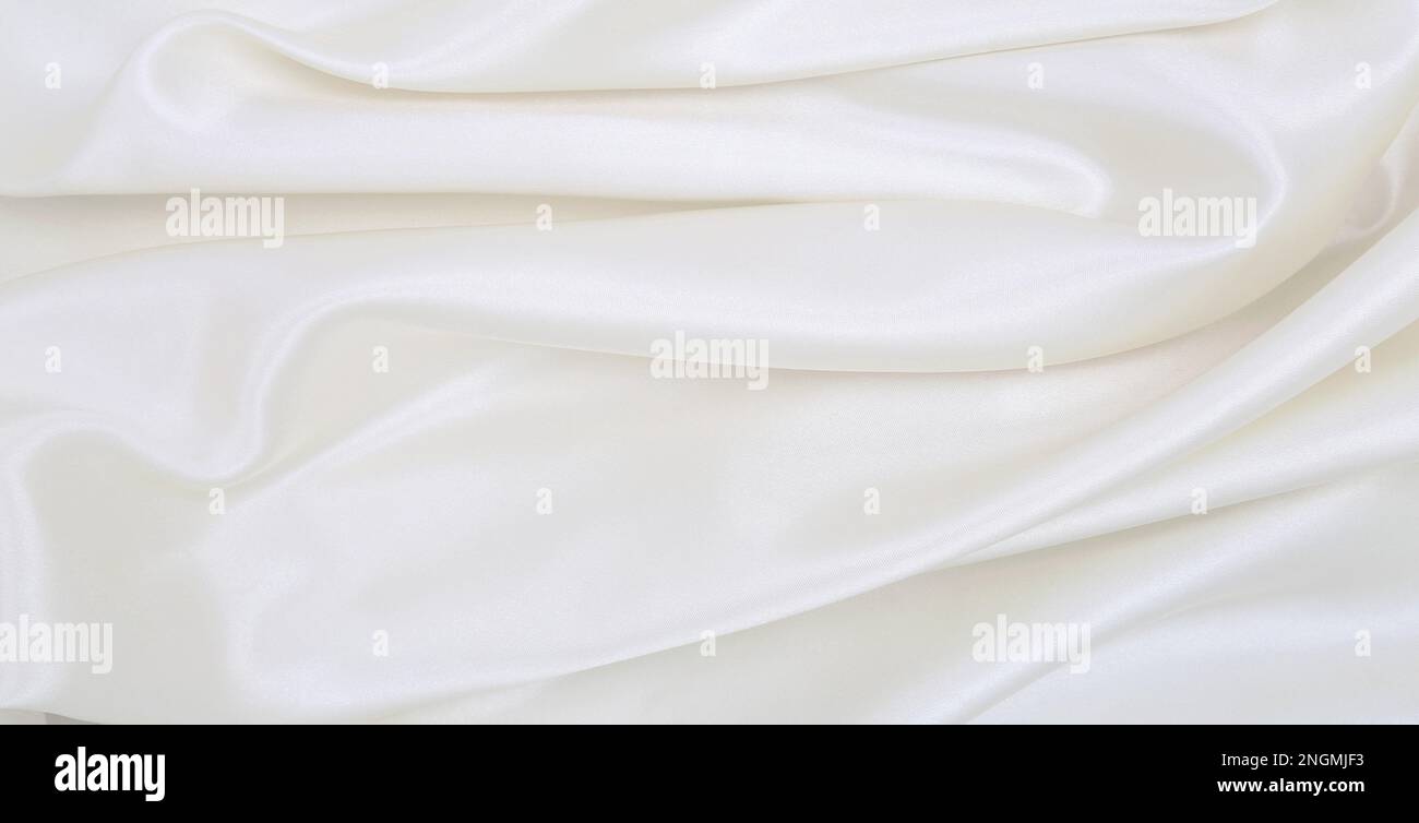 Smooth elegant white silk or satin luxury cloth texture can use as ...
