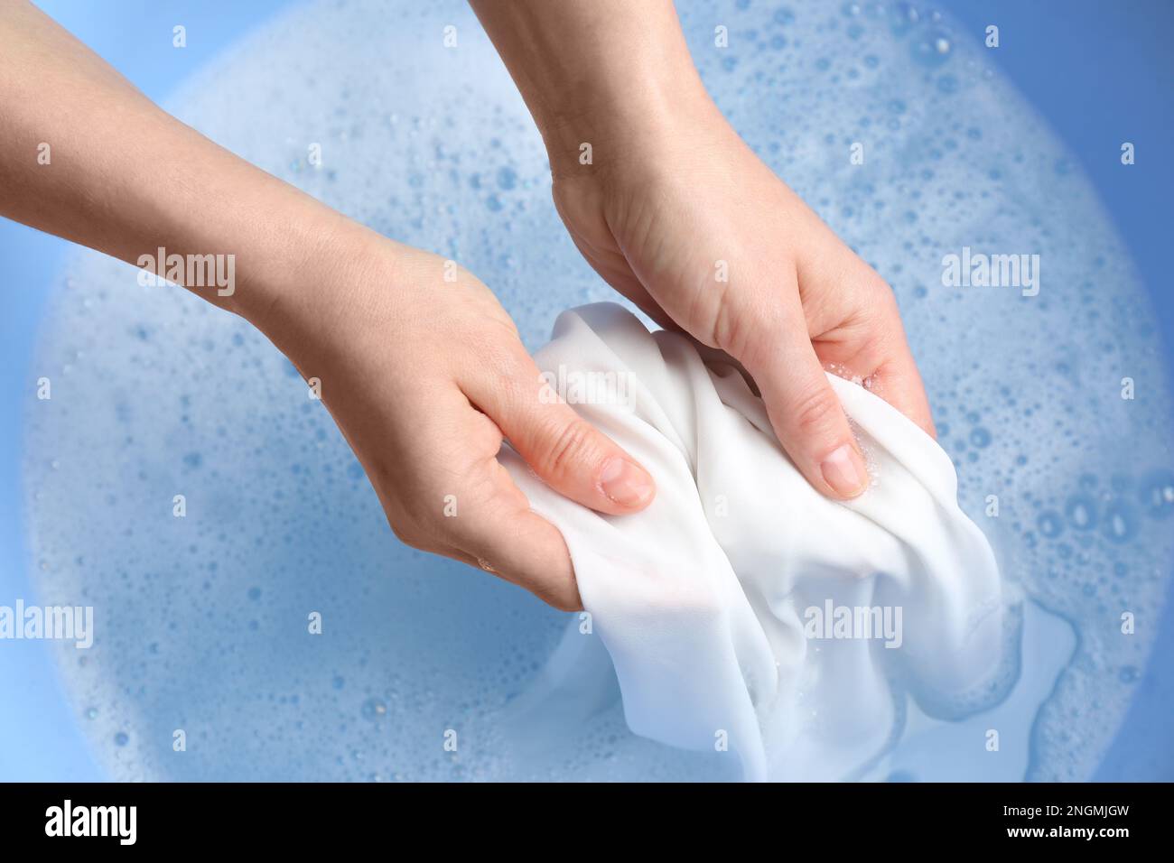 Top view of woman hand washing white clothing in suds, closeup Stock ...