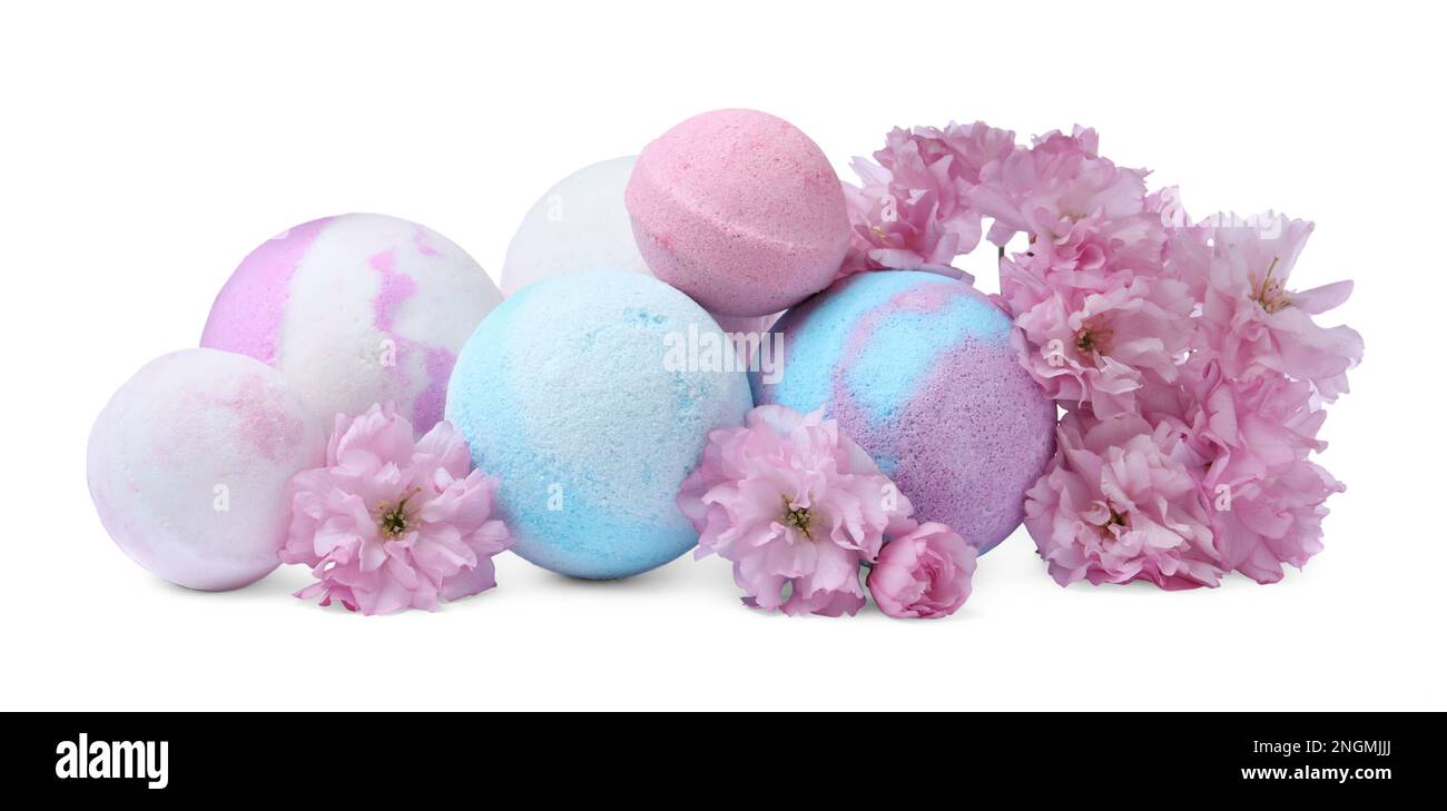 Fragrant bath bombs and sakura flowers on white background Stock Photo ...