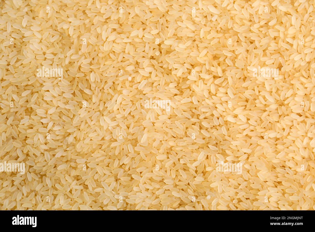 Heap of rice as background, top view. Veggie seeds Stock Photo - Alamy