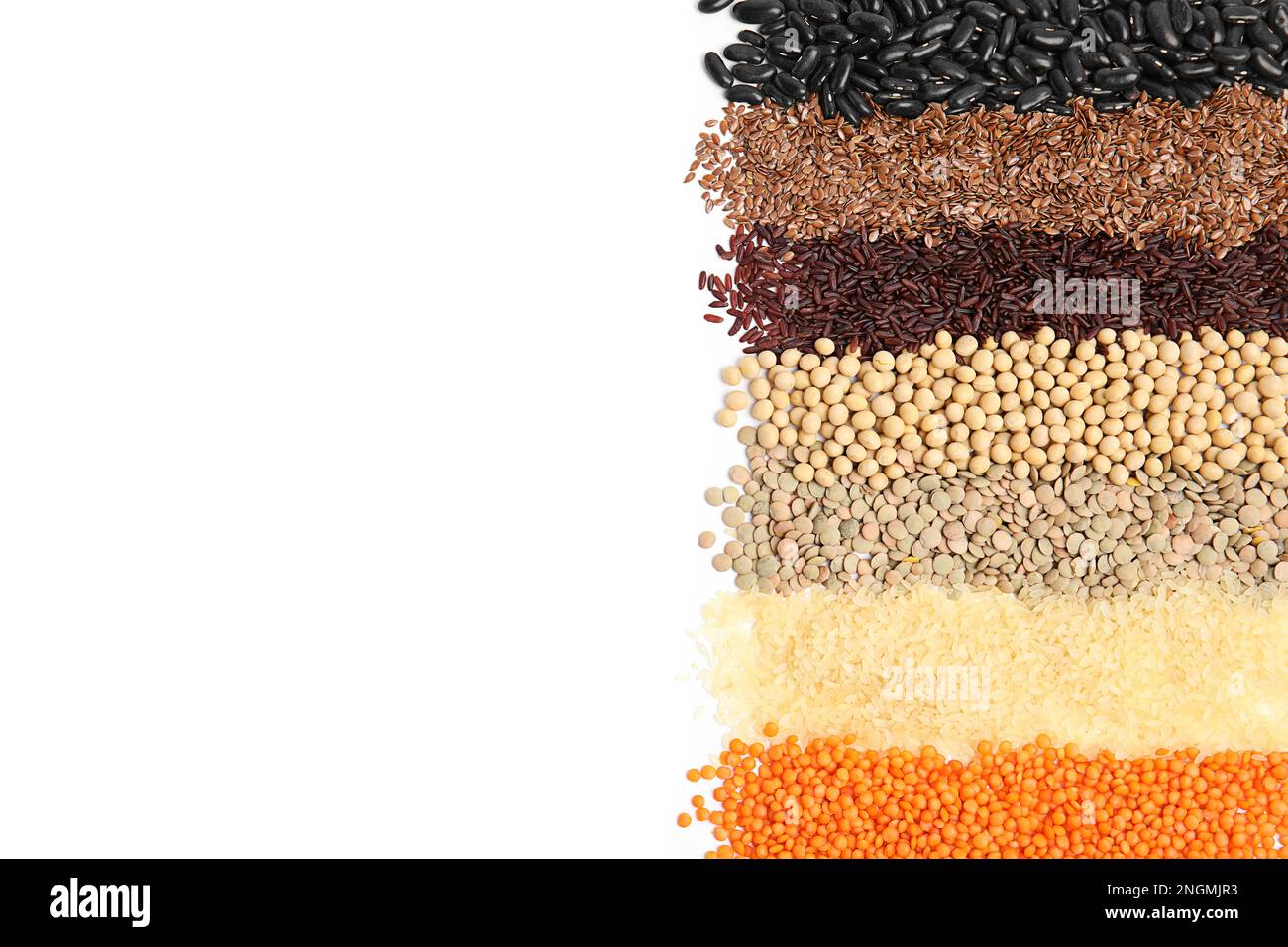 Various raw veggie seeds on white background, top view Stock Photo - Alamy