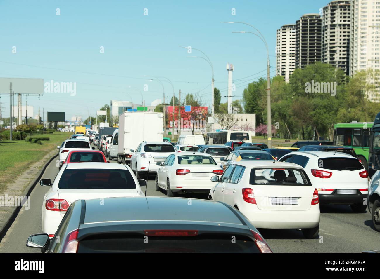Cars in traffic jam on city street Stock Photo - Alamy