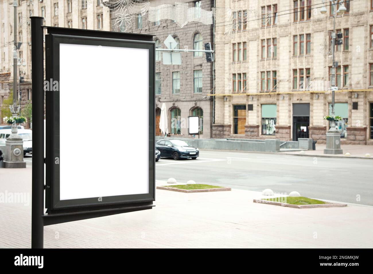 Blank advertising board on city street. Space for design Stock Photo ...