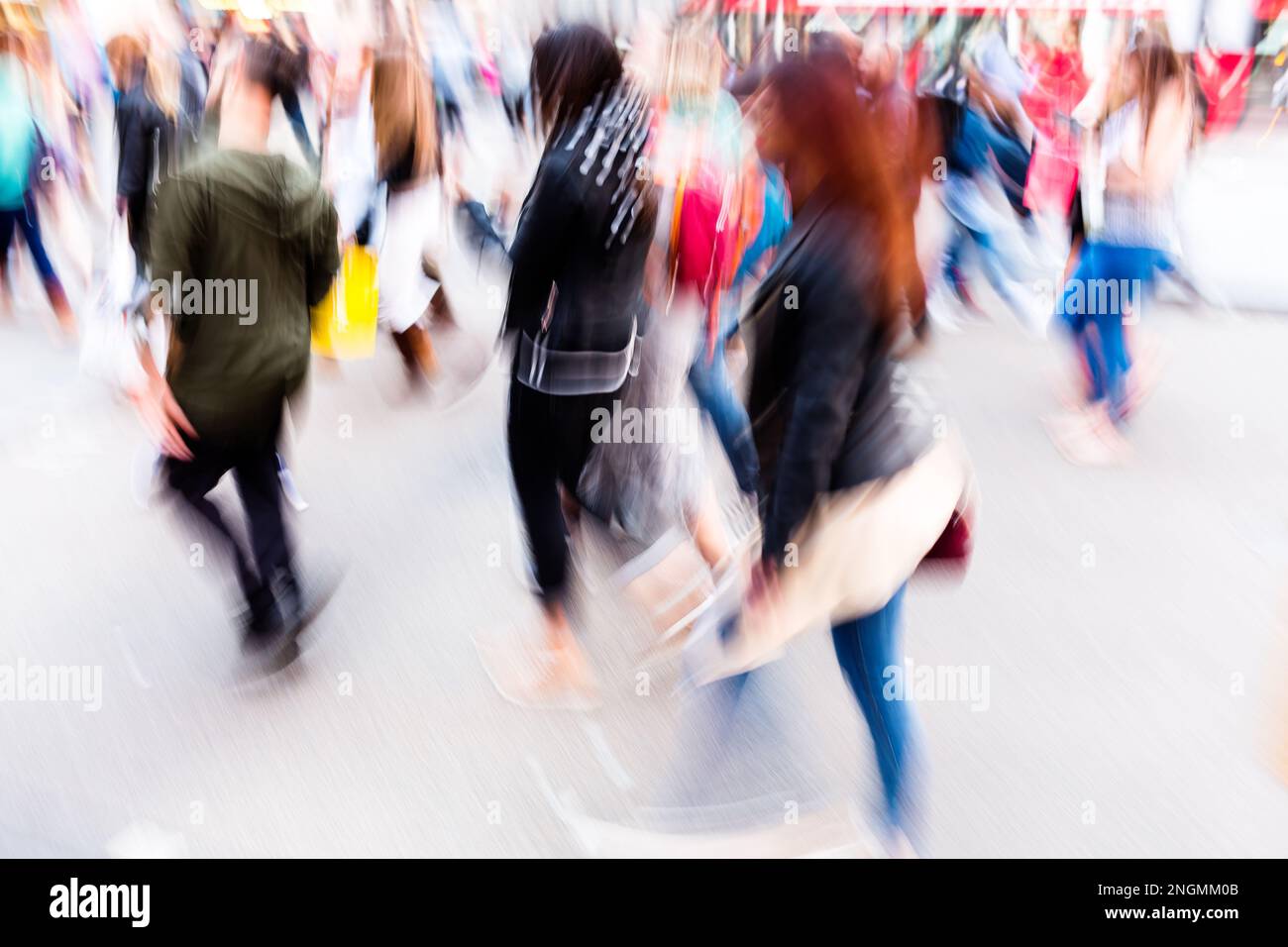 creative blurred image of crowds of people on the move in the busy city ...
