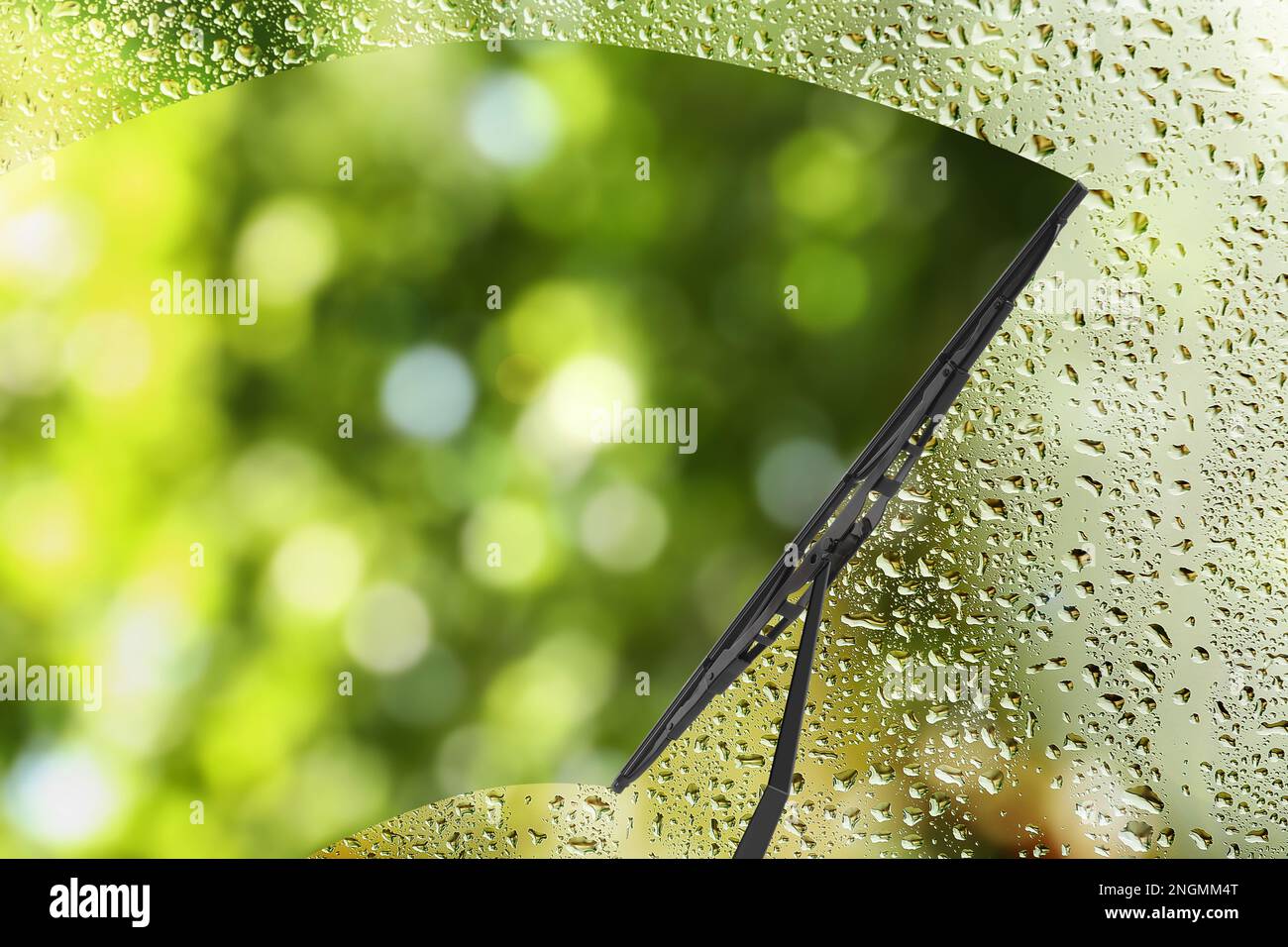 Car windshield wiper cleaning water drops from glass Stock Photo - Alamy