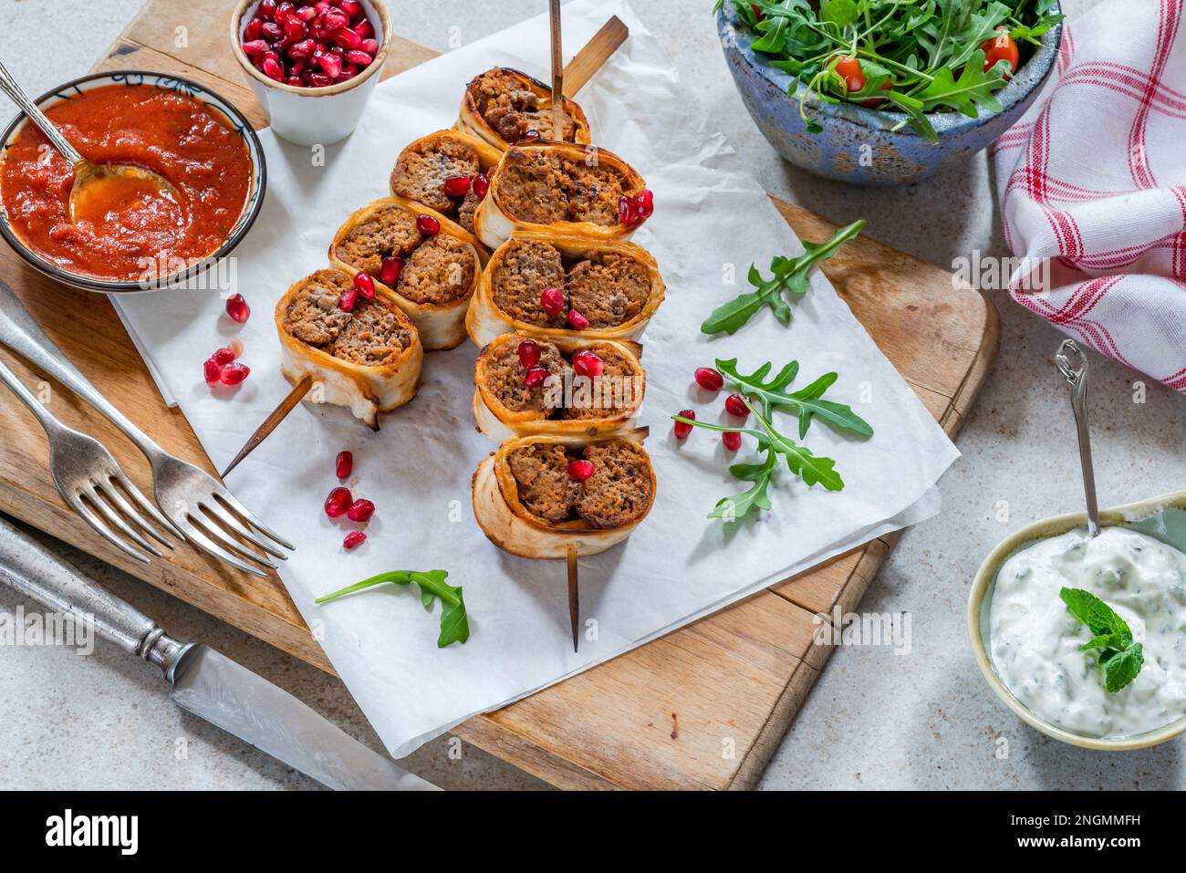 Beyti - Turikish lamb kofte-style kebab wrapped in flatbread Stock ...