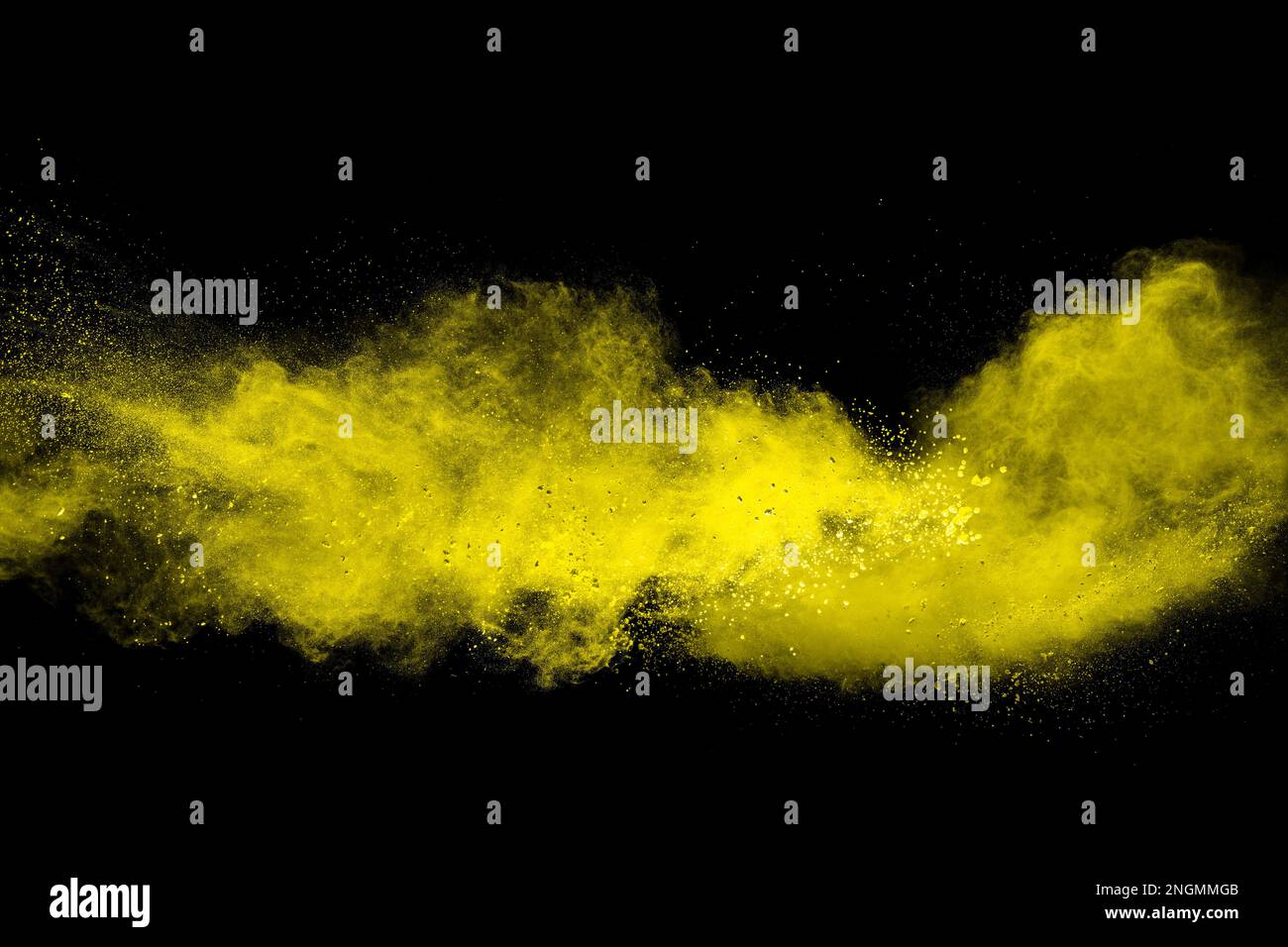Yellow dust particle explosion on black background.Yellow powder splash ...