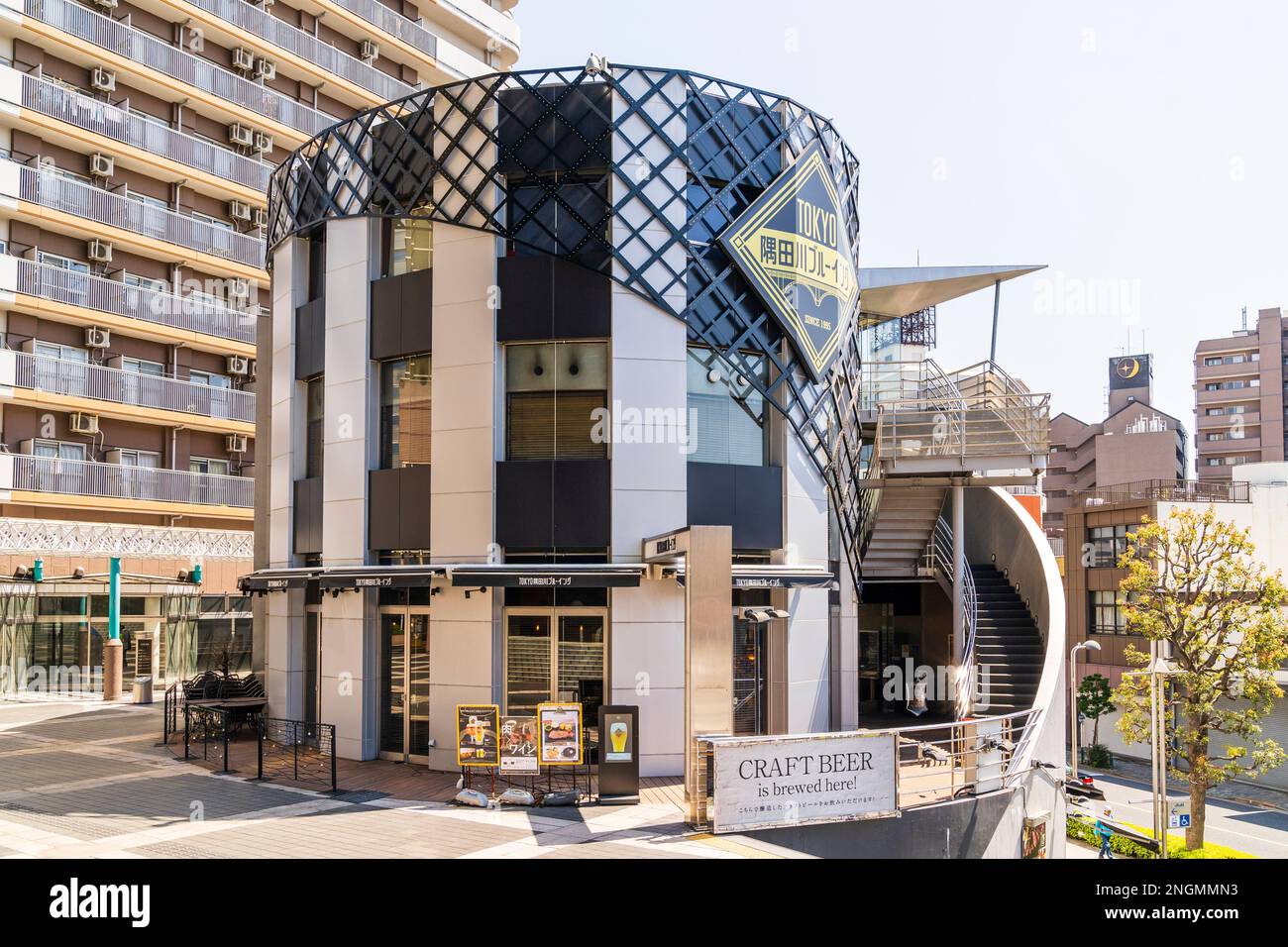 Tokyo, Asakusa. Entrance to the round modern Asahi Annex building, home ...