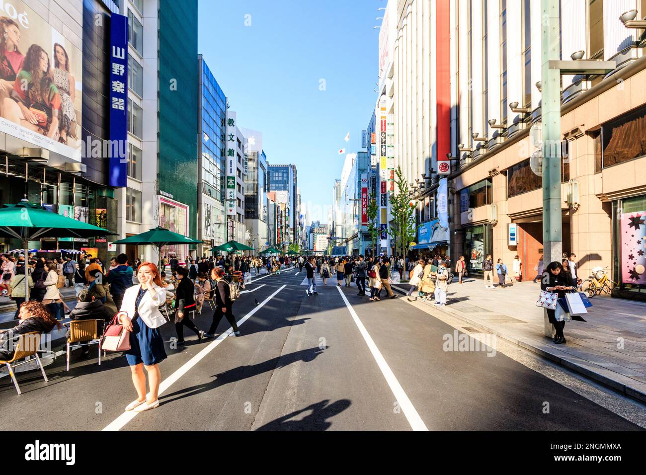 Ginza, Tokyo's upmarket shopping district. Street view by Mikimoto and ...