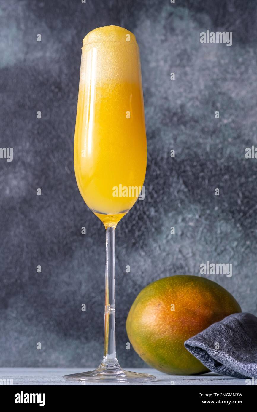Flute Glass of Mango Mimosa cocktail on gray background Stock Photo - Alamy