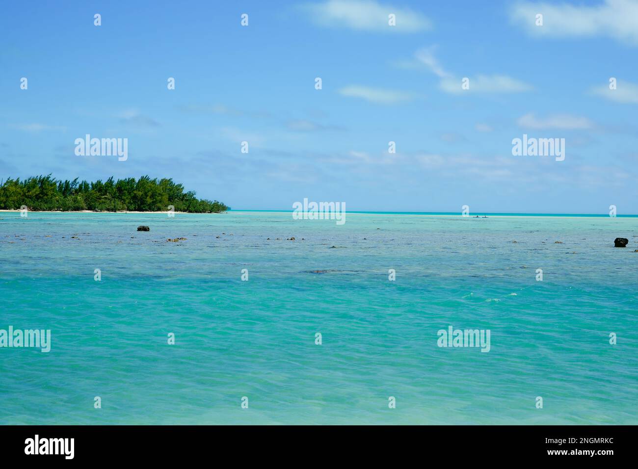 Ocean view to tropical South Pacific island on horizon Stock Photo - Alamy