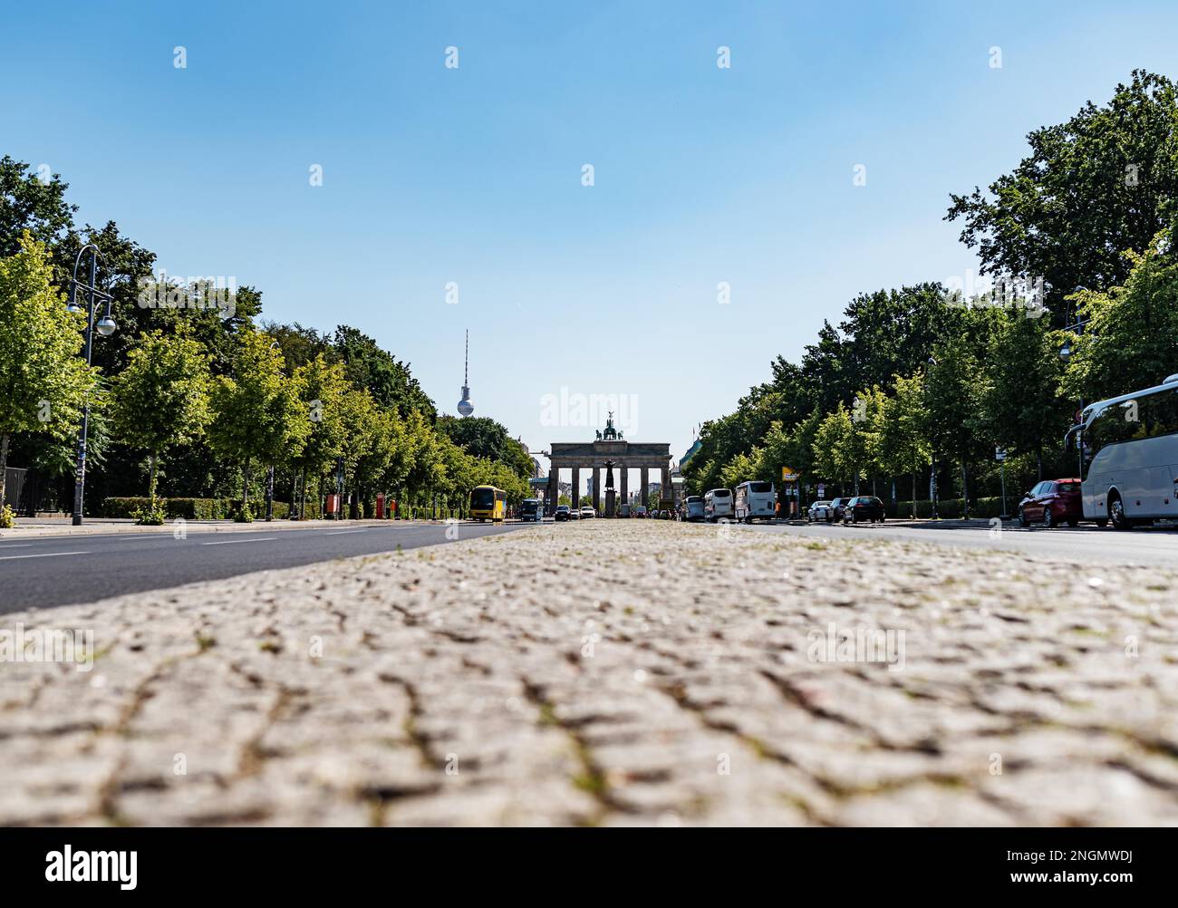 low angle view of Brandenburg Gate and 17 June Street in Berlin ...